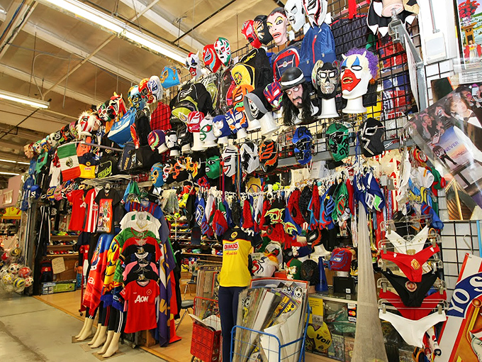 Superhero costumes hang like colorful sentinels—because sometimes adulting requires a cape, mask, and secret identity discount shopping powers.