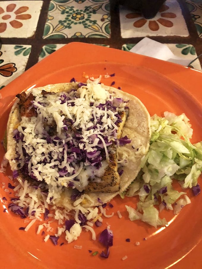 This fish taco isn't just a meal, it's a beach vacation on a plate—fresh, vibrant, and topped with enough purple cabbage to make a fashion designer jealous.