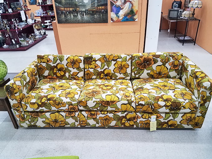 A floral sofa that screams "1987 called and wants its living room back" in the best way.