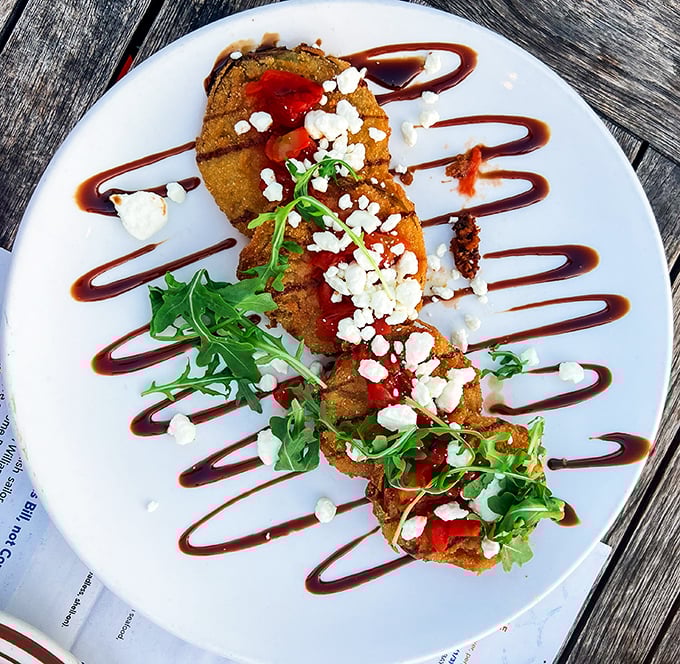 Fried green tomatoes dressed up fancier than a debutante ball – and twice as charming.