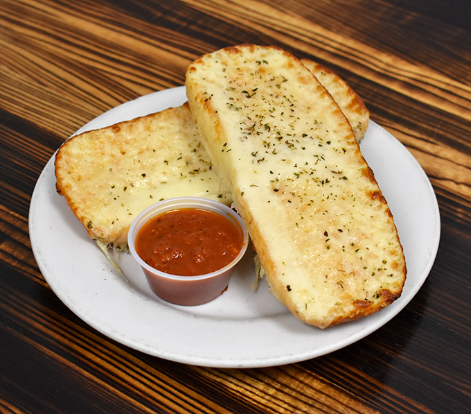 Garlic cheese bread that could make a vampire reconsider its life choices—crisp exterior, pillowy inside, and enough cheese to make Wisconsin proud.