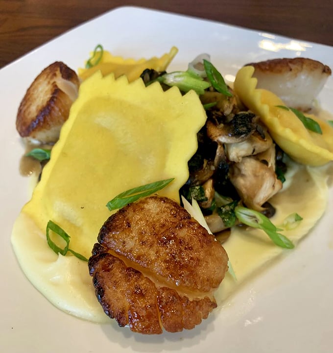 Scallops and pasta playing hide-and-seek in a buttery sauce—a dish that would make Neptune himself request a reservation.