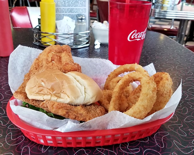 The tenderloin sandwich—a Midwest masterpiece that makes you wonder why you'd ever settle for those fancy big-city sandwiches with unpronounceable ingredients.