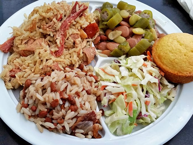 Southern comfort on a plate. Rice and beans sharing space with fresh slaw and cornbread—a harmony of flavors that sings like a gospel choir.