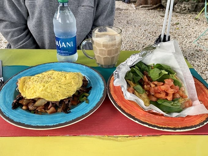 This omelet doesn't just sit on the plate—it lounges there confidently, knowing it's about to become the highlight of someone's vacation day.