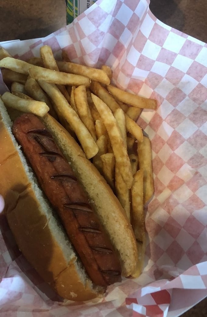 Not just any hot dog—a smoke-infused revelation nestled in a pillowy bun. The diagonal cuts aren't just for show; they're flavor channels for maximum enjoyment.