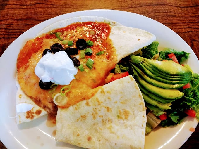 Huevos rancheros with perfectly sliced avocado—proof that California knows how to elevate breakfast without losing its soul.