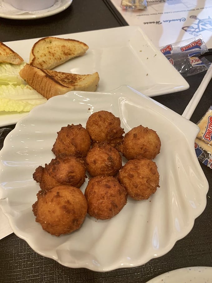 Hushpuppies so perfectly golden they should come with a warning: "May cause involuntary food noises." Crispy outside, fluffy inside—textbook perfection.