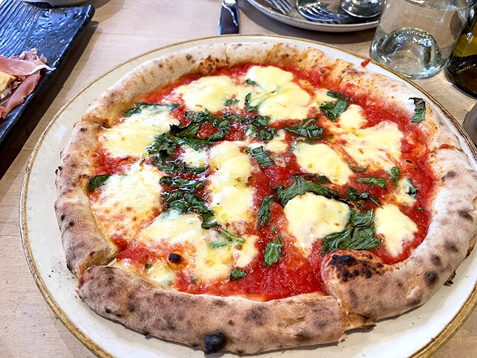 The margherita pizza—so simple yet so perfect. Like the little black dress of Italian cuisine, it never goes out of style.