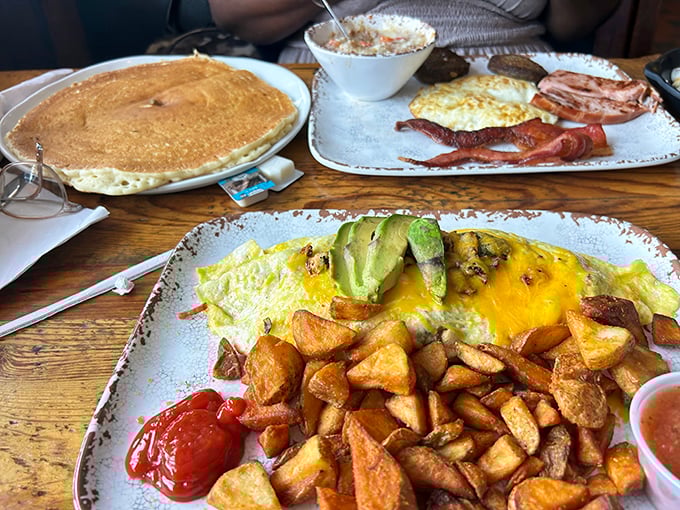 Breakfast alchemy at its finest: golden pancakes, crispy potatoes, and eggs that make you question why you'd ever skip the most important meal.