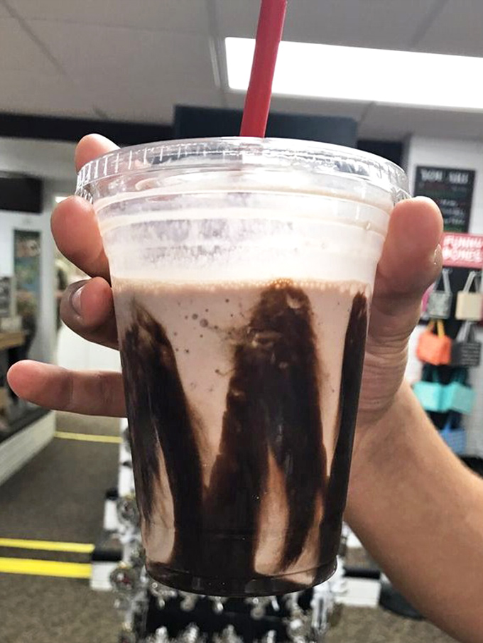 This isn't just a milkshake—it's a drinkable masterpiece where chocolate performs an interpretive dance against the glass.