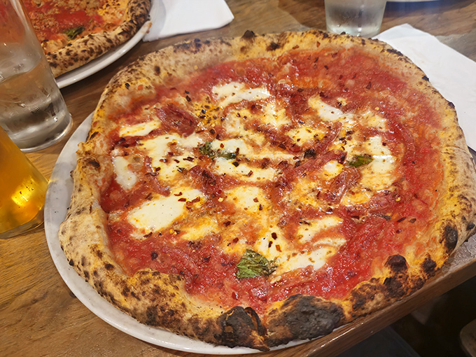 Pizza perfection to go? The box can barely contain the excitement of what's inside—pillowy crust, bright sauce, and cheese that makes you weak in the knees.