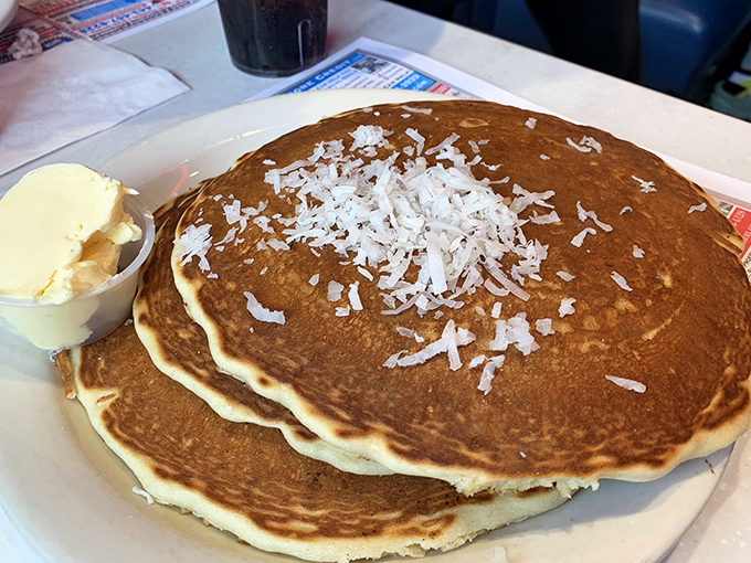 These aren't pancakes – they're fluffy golden clouds that happened to land on your plate this morning.