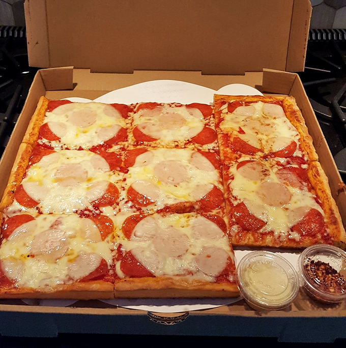 The sauce-on-top approach isn't rebellion—it's enlightenment. Those pepperoni discs are doing a synchronized swimming routine in tomato glory.