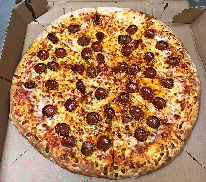 The classic pepperoni pizza—where each little cup of pepperoni holds a tiny pool of flavor that makes you wonder why you ever considered ordering anything else.