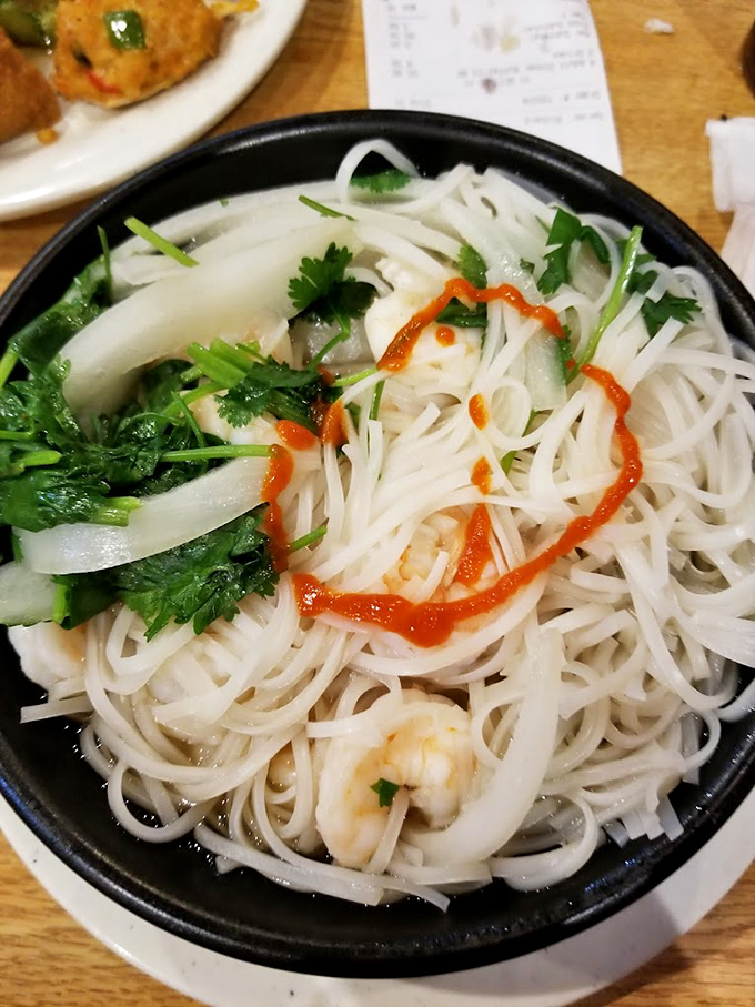 Delicate rice noodles swimming in fragrant broth with fresh herbs – proof that sometimes the most comforting foods are also the most elegant.