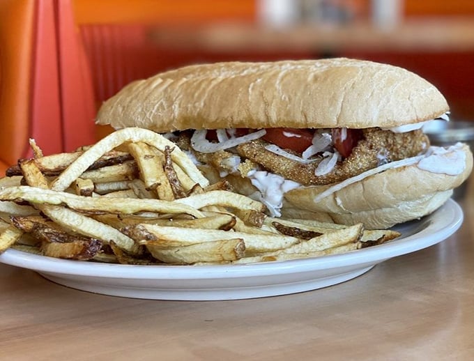This sandwich isn't just lunch—it's an architectural marvel of crispy, creamy, and crunchy textures that demands a two-handed commitment.