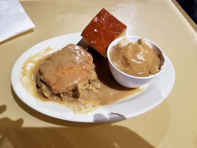 Some pork chops are just food. This gravy-smothered masterpiece is therapy—the kind that makes you close your eyes and forget your problems.