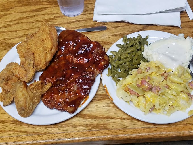 BBQ ribs and fried chicken sharing a plate with perfect harmony—like the food equivalent of Dolly Parton and Kenny Rogers performing "Islands in the Stream."