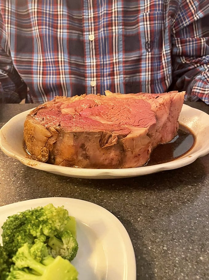 The prime rib – pink as a sunset, juicy as gossip, and portioned like they want you to hibernate for winter. This is meat that means business.