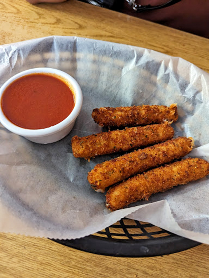 Fried provolone sticks: where cheese meets childhood joy in a crispy golden package. The dipping sauce isn't optional—it's the law.