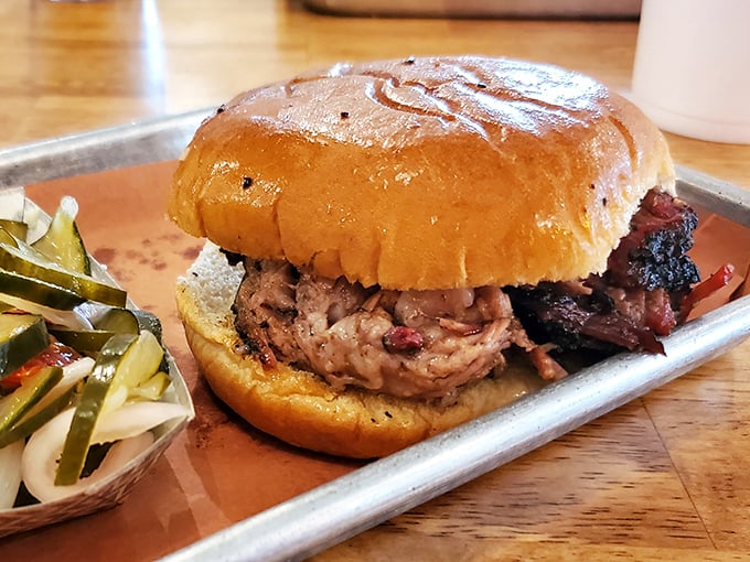 The pulled pork sandwich—humanity's greatest achievement since the moon landing. That soft bun cradles smoky perfection like it's holding a newborn.