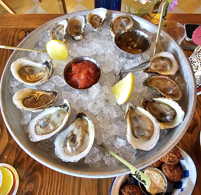 Briny treasures on ice—these oysters arrive like jewels from the sea, ready to slide down with a squeeze of lemon and a dash of adventure.