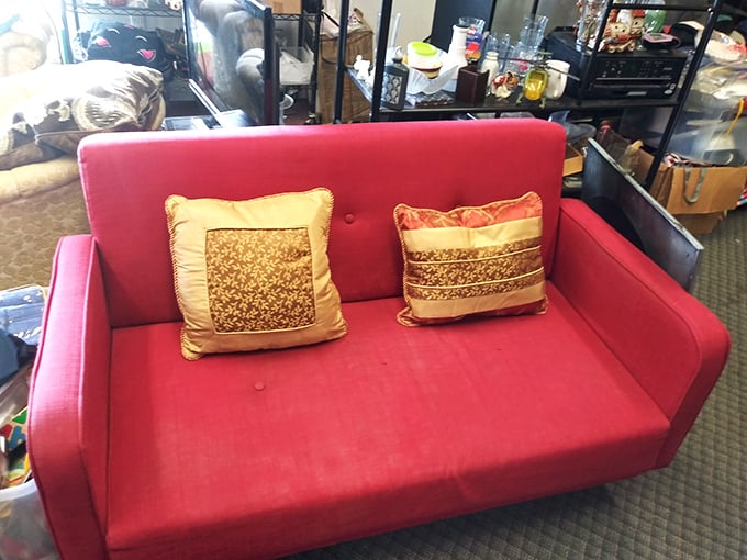 This mid-century inspired red sofa doesn't just make a statement—it delivers a full TED talk on bold design choices and the timeless appeal of clean lines.