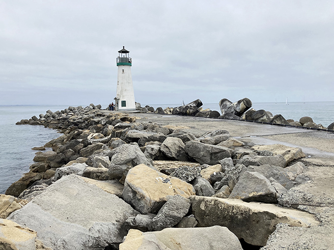 Nature's jigsaw puzzle—these massive rocks protect the harbor while creating a rugged pathway that makes you feel like you're on a mini adventure.