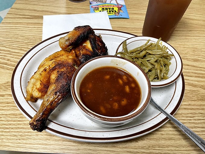 Golden rotisserie chicken that looks like it stepped straight out of a Norman Rockwell painting of perfection.