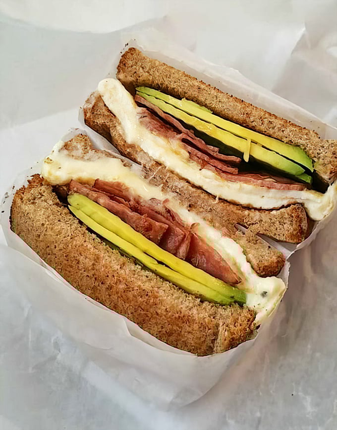 The ham and cheese with avocado isn't trying to reinvent the wheel—it's just making that wheel absolutely delicious on toasted wheat.