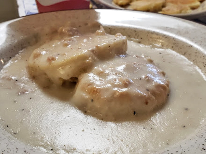 These biscuits and gravy aren't just breakfast—they're an edible hug that says "everything's gonna be alright" in the universal language of comfort.