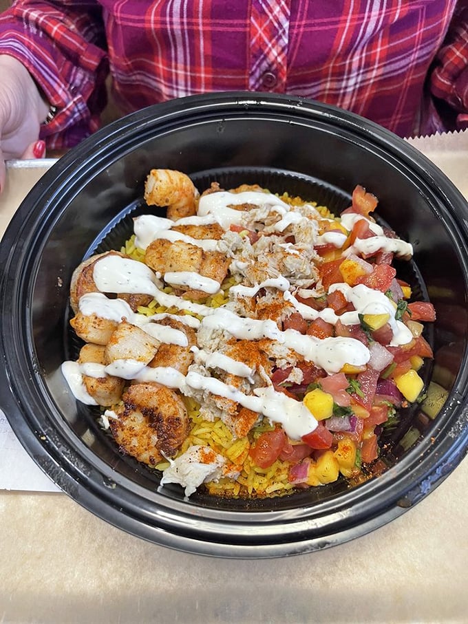 Behold the legendary Seafood Bowl—where shrimp, scallops, and that famous Greek sauce create a symphony that makes your taste buds stand and applaud.