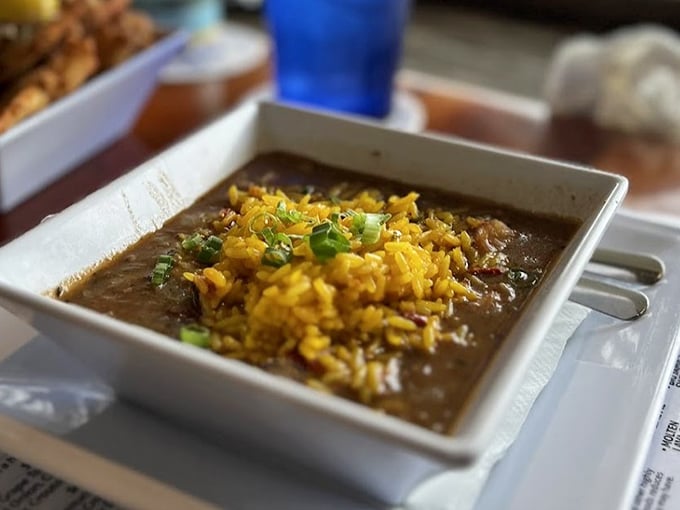 Seafood gumbo so rich and complex it could tell stories about generations of Gulf Coast cooking if it wasn't too busy being delicious.