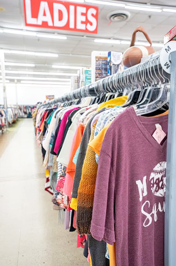 Shirts hang in rainbow formation, proving that style doesn't require breaking the bank account.