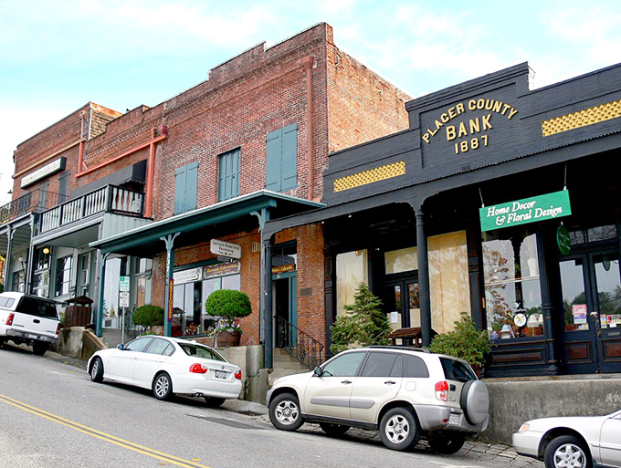 The Placer County Bank building anchors a street where every storefront tells a story—brick, balconies, and not a chain store in sight.