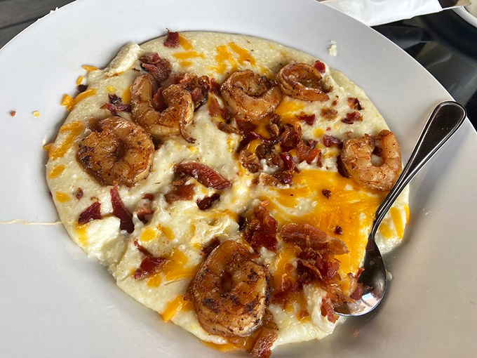 Shrimp and grits at Trip's proves that breakfast can be both comfort food and luxury – like wearing silk pajamas while watching Saturday morning cartoons.