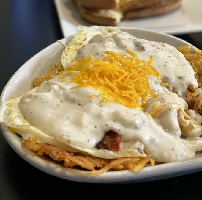 Behold the skillet breakfast—a glorious mess of potatoes, eggs, and sausage gravy that laughs in the face of diet culture.