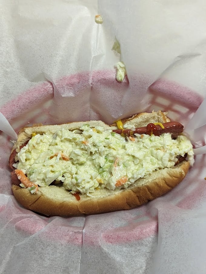 The slaw dog—where creamy, crunchy cabbage meets savory hot dog in a romance that would make Nicholas Sparks reach for his napkin.