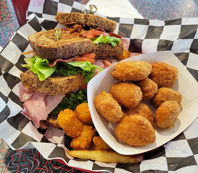 A sandwich platter that doesn't know the meaning of restraint. Those golden tots are the backup singers to the sandwich's lead vocal.