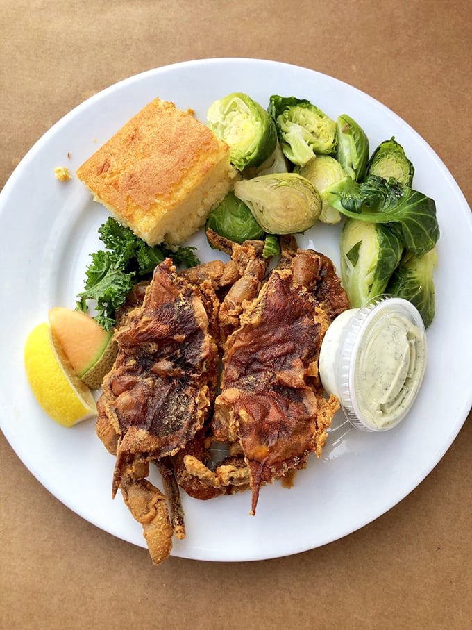 Soft shell crab that's had a perfect spa day in the fryer. Crispy, delicate, and served with sides that know their place in this seafood symphony.
