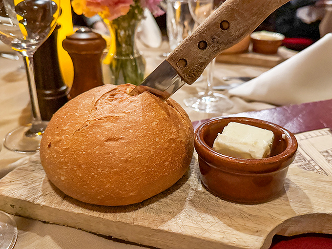 Warm bread and room-temperature butter—civilization's perfect pairing and the opening act to meat's main event. Simple pleasures at their finest.