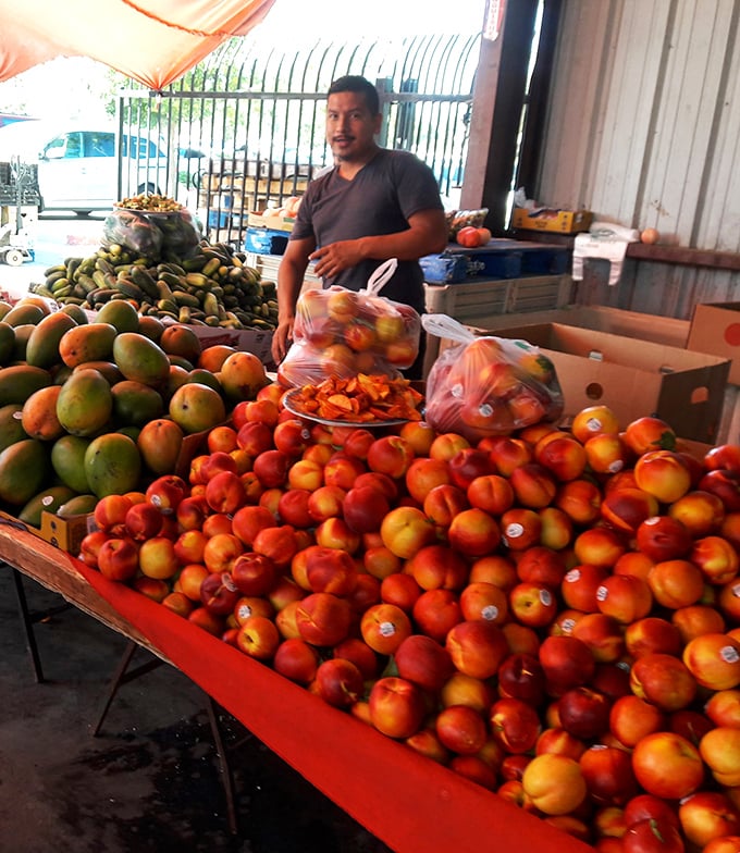 Fruit stand abundance that puts grocery stores to shame – these peaches and mangoes didn't travel from another hemisphere to meet you.