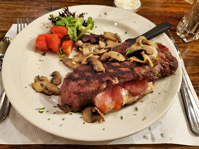 A perfectly seared steak that doesn't need fancy explanations—just mushrooms, a touch of char, and the quiet confidence of being done right.