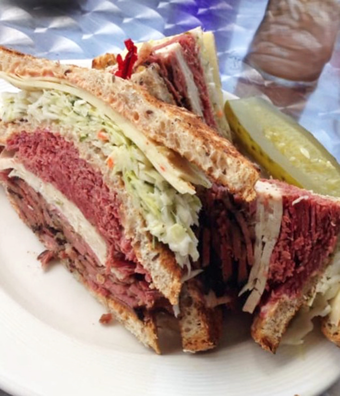 Layer upon glorious layer of deli meat creates what can only be described as the Everest of sandwiches – bring your appetite and possibly a sherpa.
