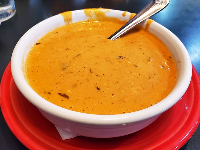 This isn't just tomato soup—it's liquid sunshine in a bowl, the kind that makes you wonder why anyone bothers with complicated food when perfection is this simple.