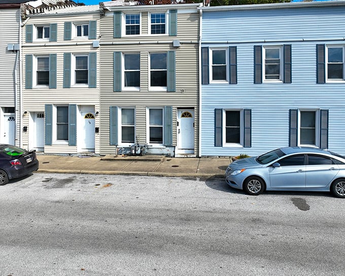 These pastel-hued townhouses aren't just homes—they're chapters in an ongoing story that's been unfolding for two centuries.