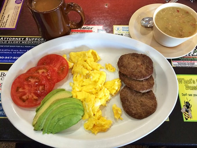 A breakfast that says "I'm being healthy-ish" with those tomatoes and avocado, while the sausage patties whisper "but let's not get carried away."