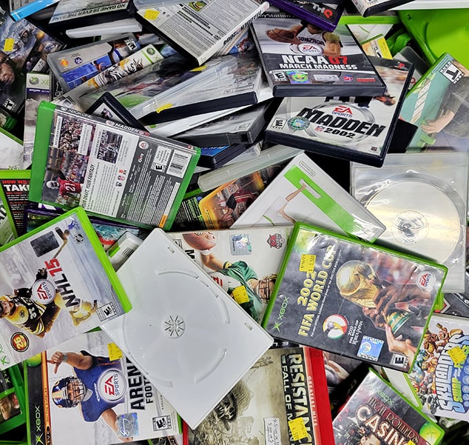 Video game graveyard or nostalgic gold mine? Madden NFL titles and forgotten classics create a time capsule of rainy Saturday afternoons.