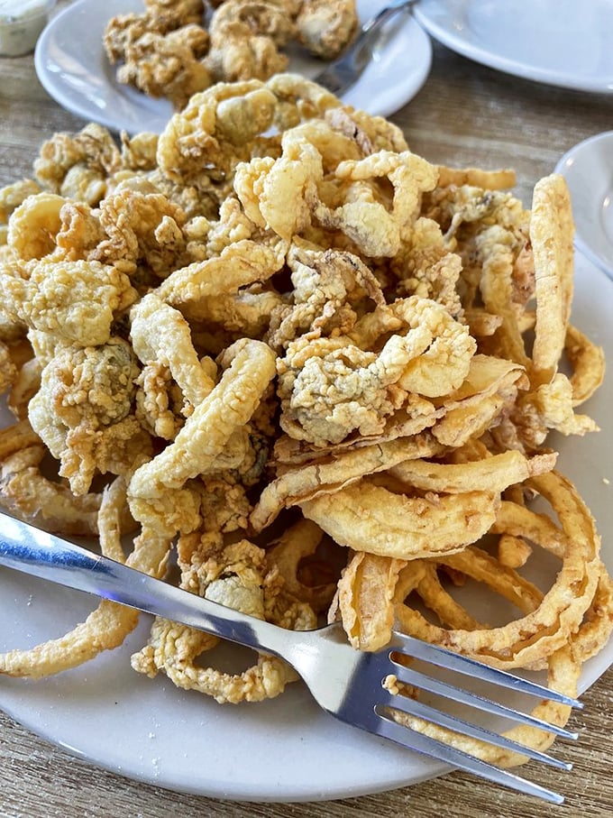 These aren't just fried clams; they're crispy little vessels of oceanic joy that make you wonder why you'd ever eat anything else.